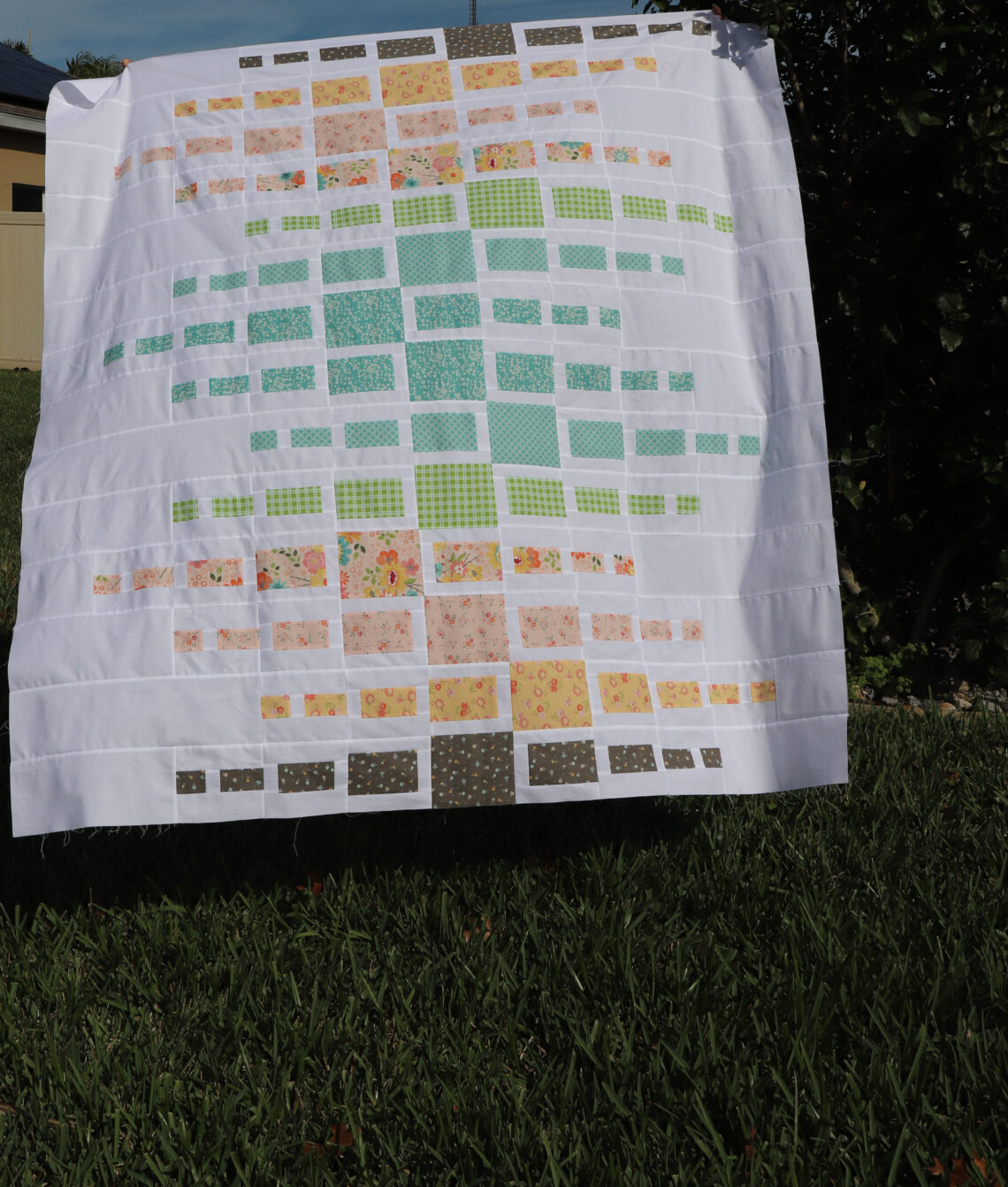 The Aftershock Quilt with Spring's in Town