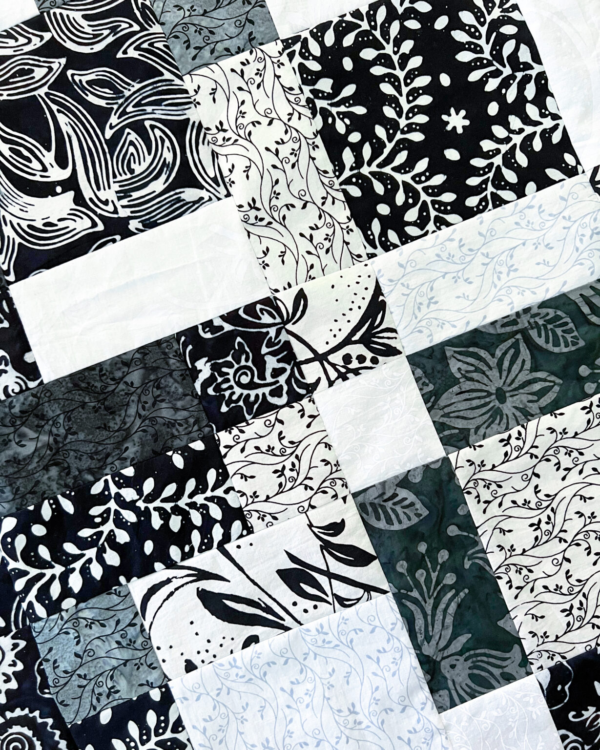 Blooms at Dusk - Disappearing Sixteen Patch Quilt